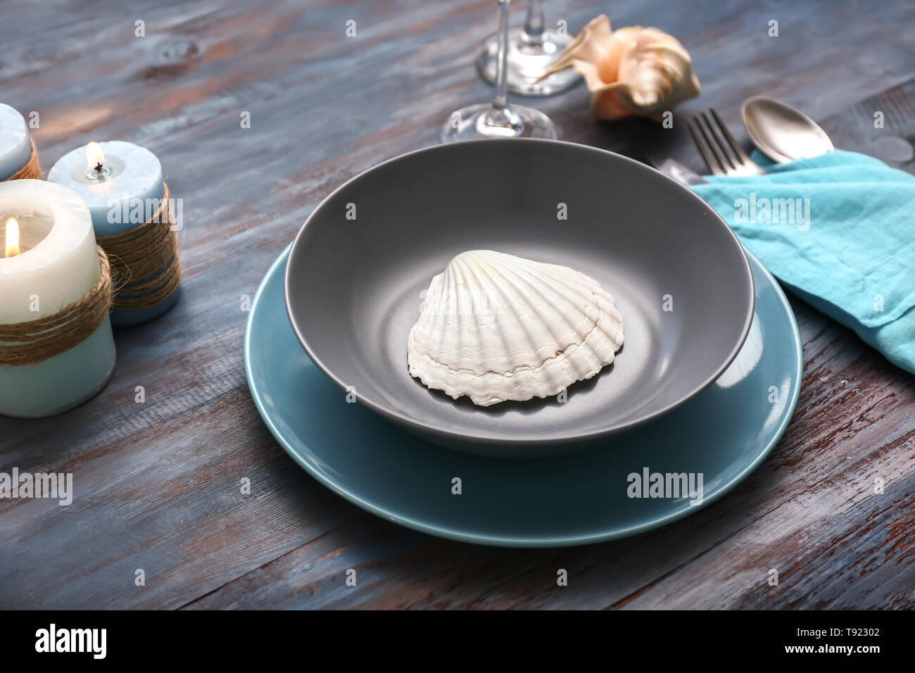 Beautiful table setting with sea shells on wooden background Stock ...