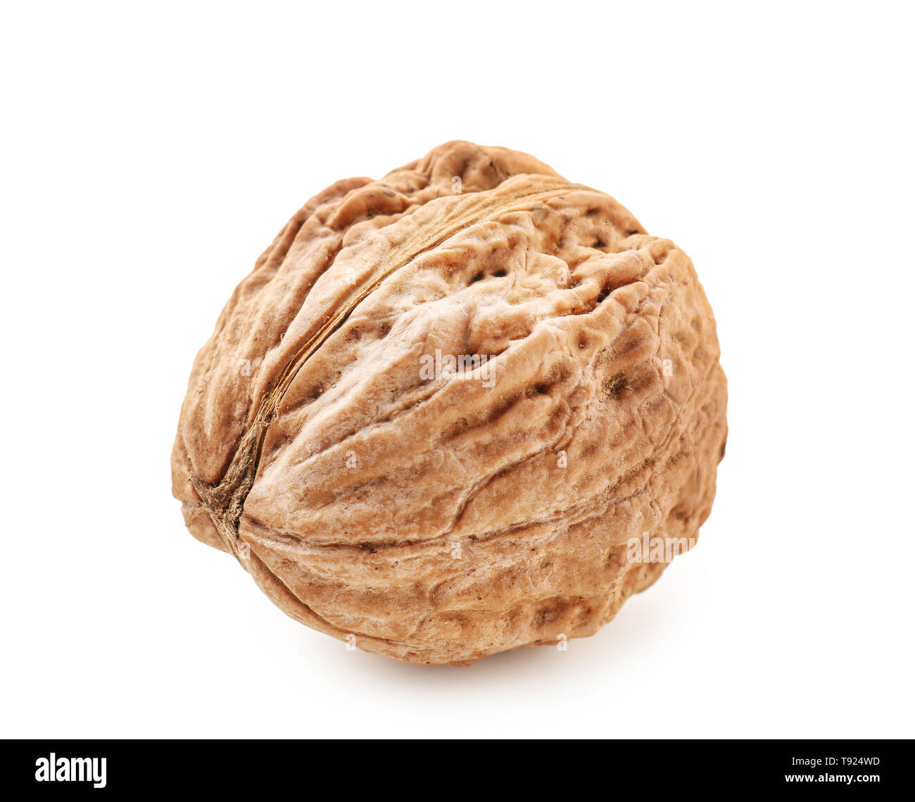 Unpeeled walnut on white background Stock Photo - Alamy