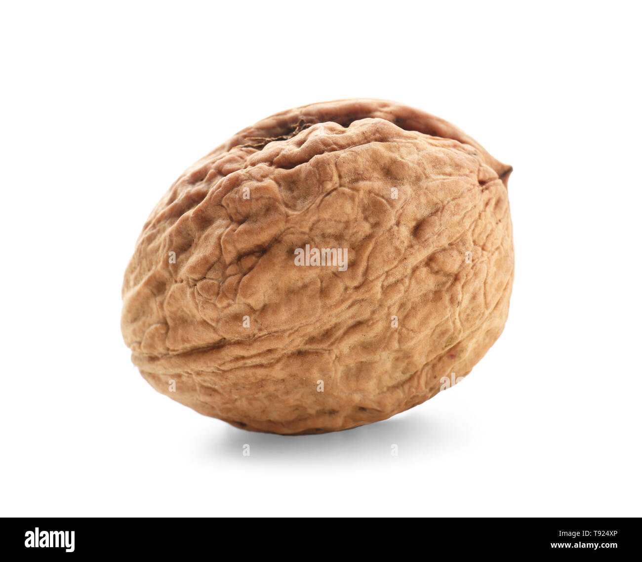 Unpeeled walnut on white background Stock Photo - Alamy