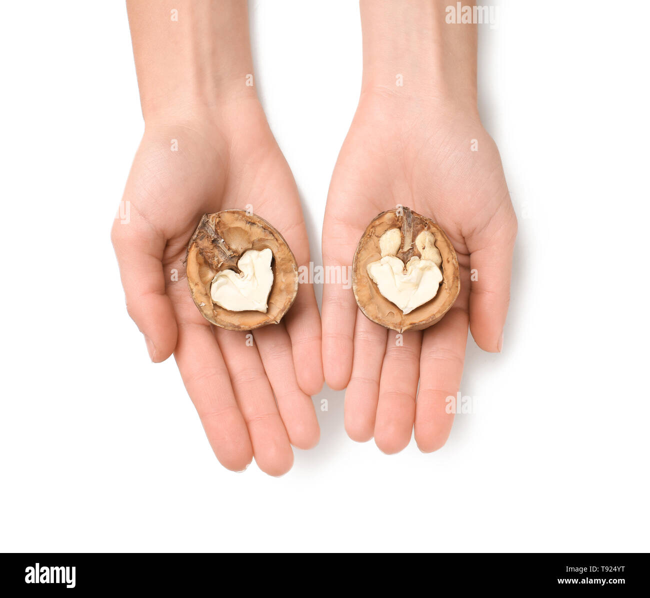 Female hands with tasty walnut on white background Stock Photo - Alamy