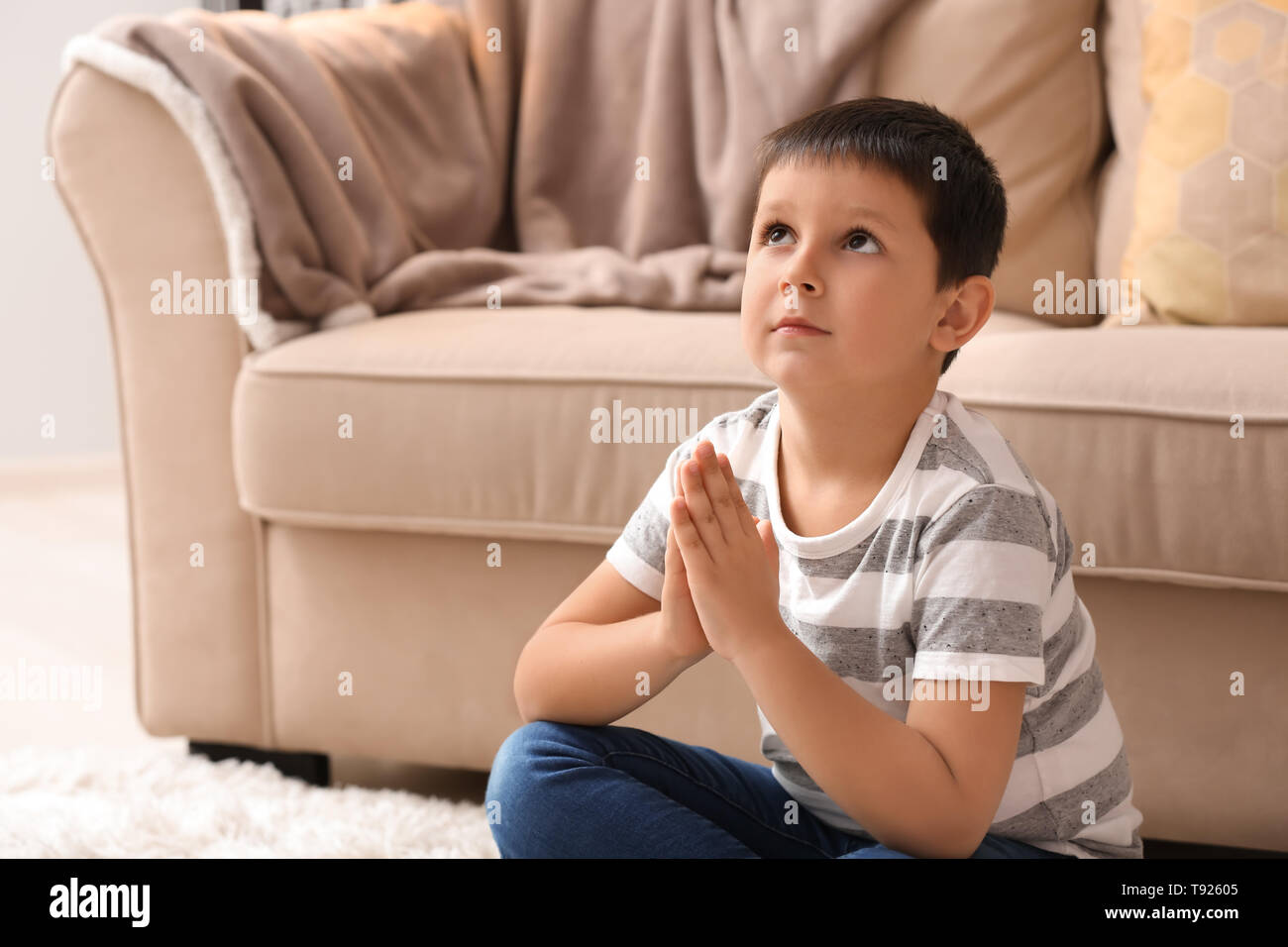 Little boy praying at home Stock Photo - Alamy