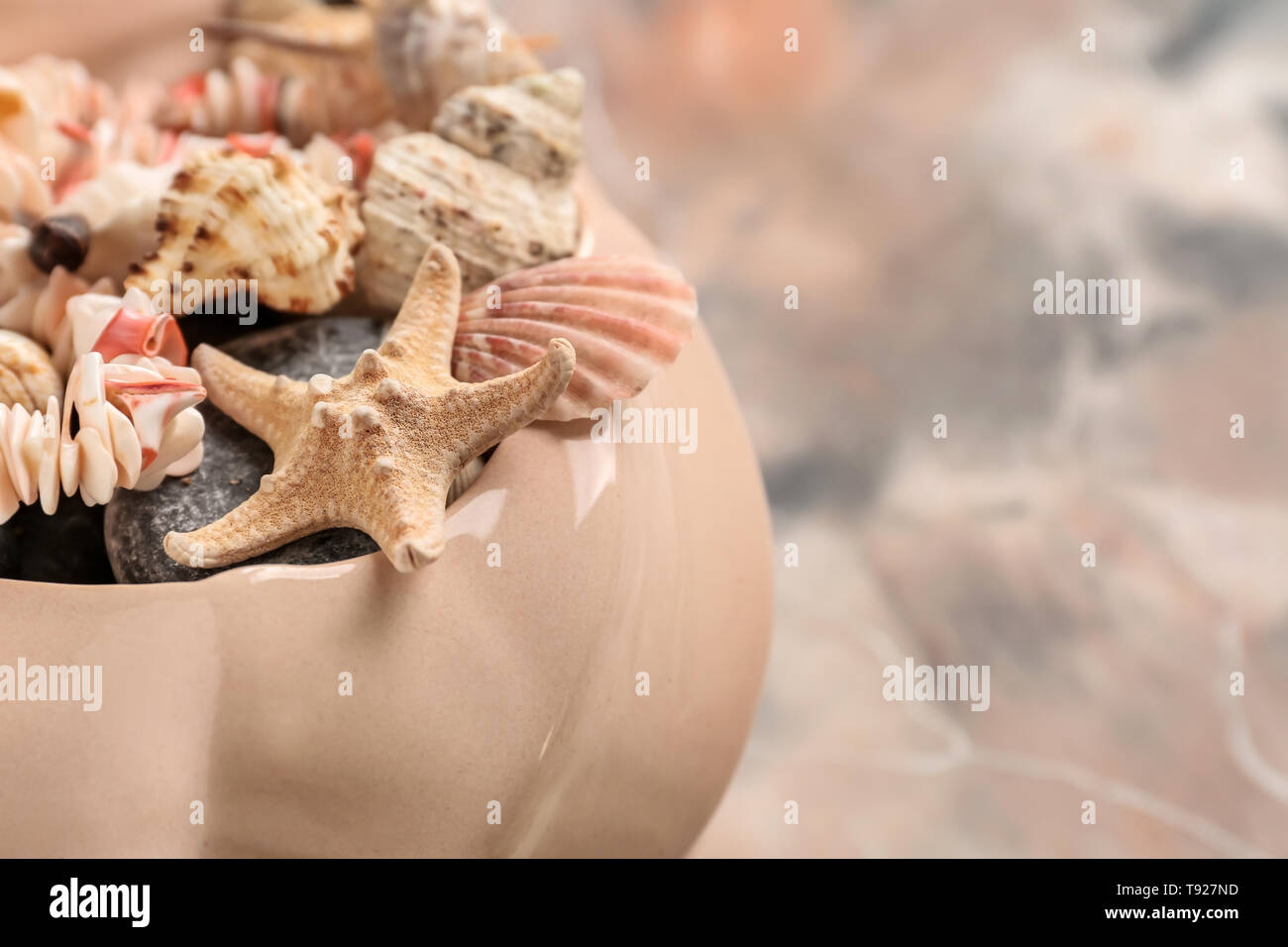 Bowl with different sea shells and starfish, closeup Stock Photo - Alamy
