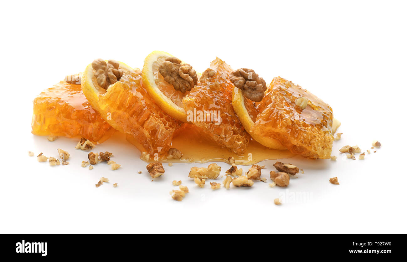 Honeycomb, lemon slices and nuts on white background Stock Photo - Alamy
