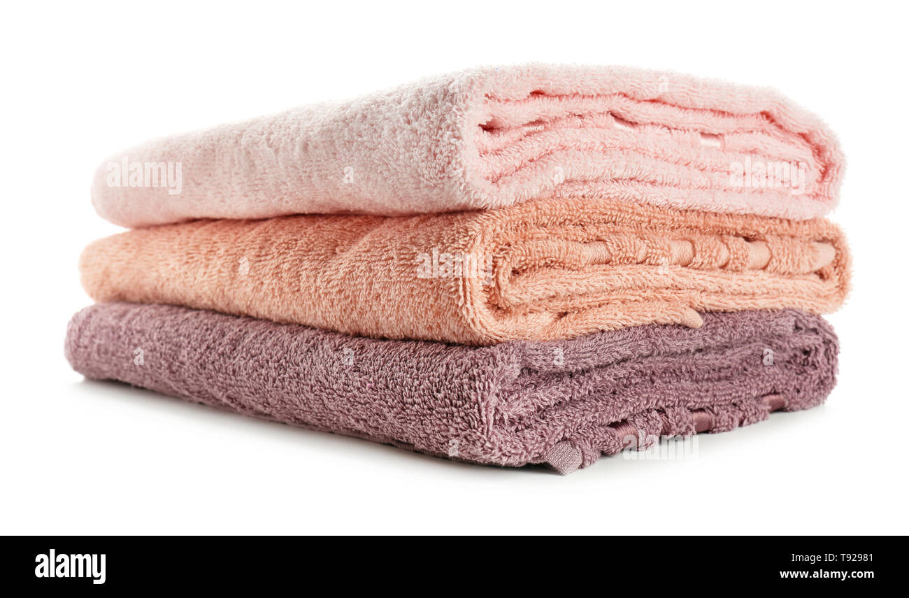 Stack of clean soft towels on white background Stock Photo - Alamy