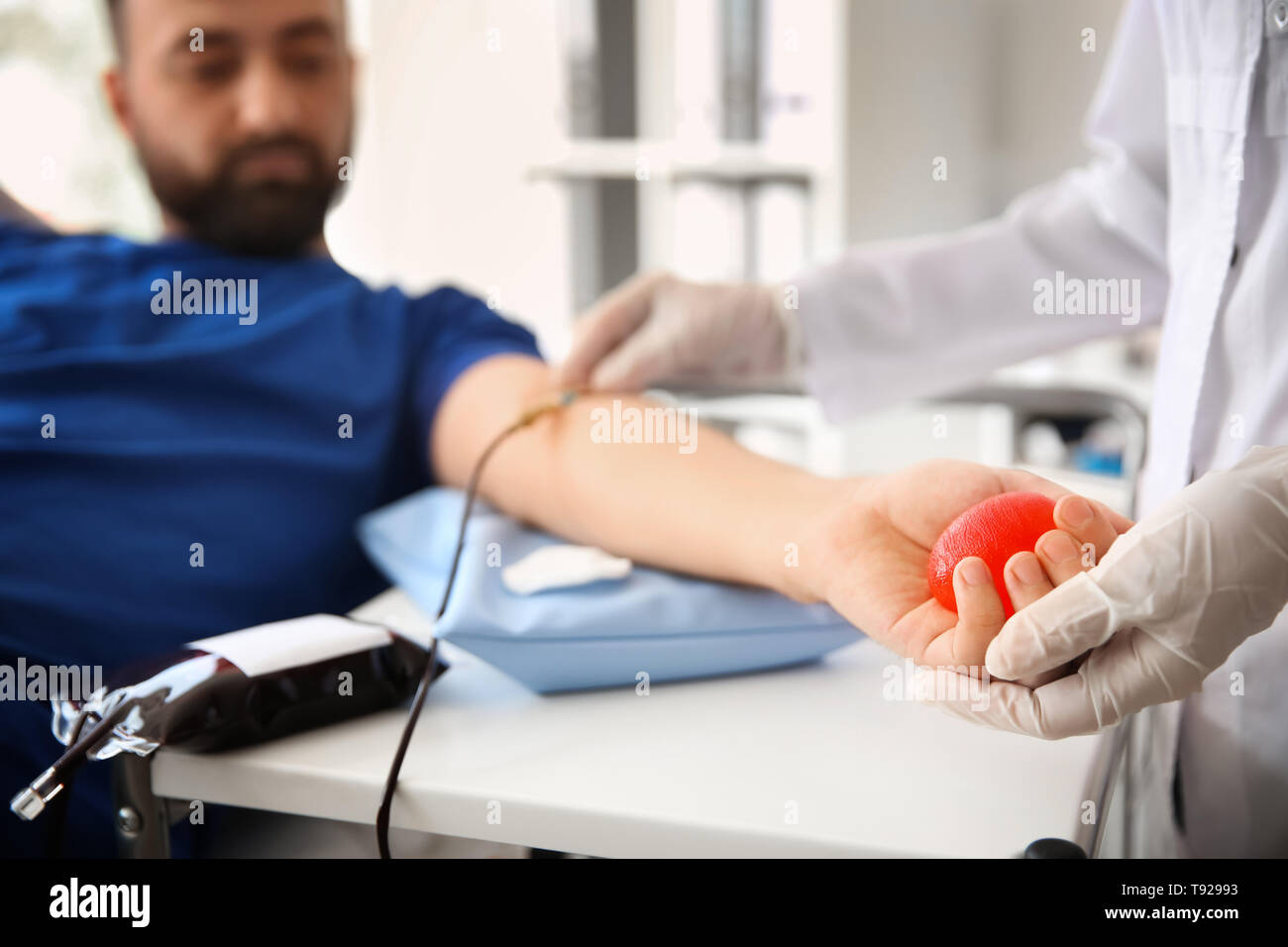 Man donating blood in hospital Stock Photo - Alamy