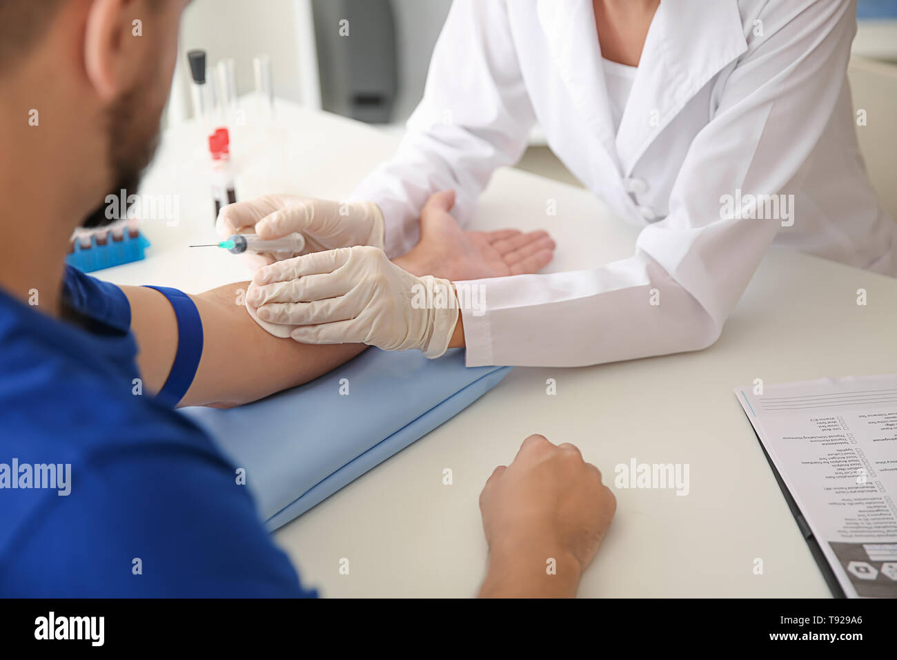 Blood tourniquet needle arm hi-res stock photography and images - Alamy
