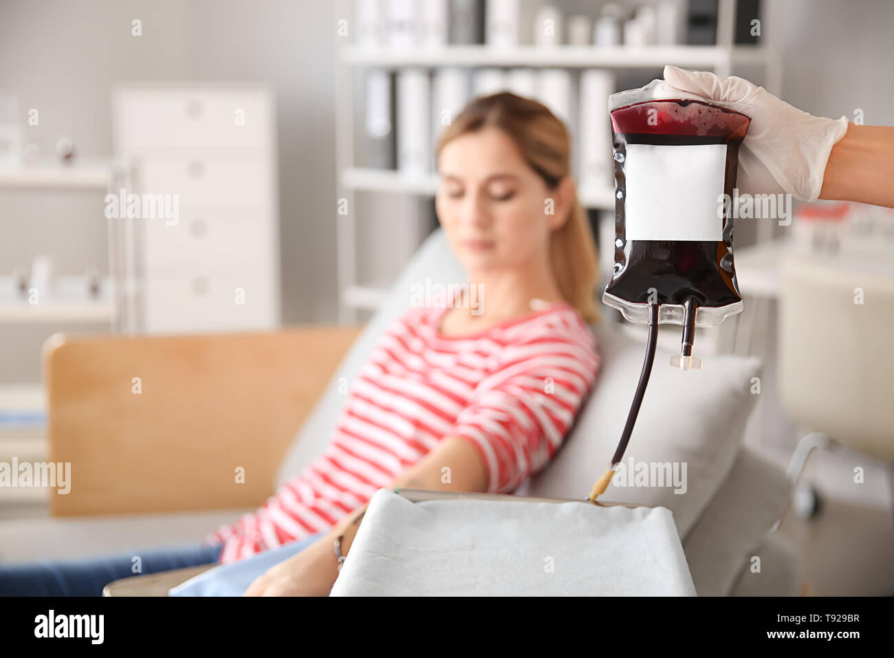 Woman donating blood in hospital hi-res stock photography and images ...