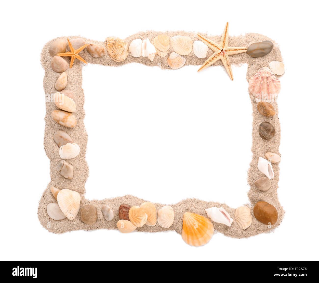 Frame made of sand, sea pebbles and shells on white background Stock ...