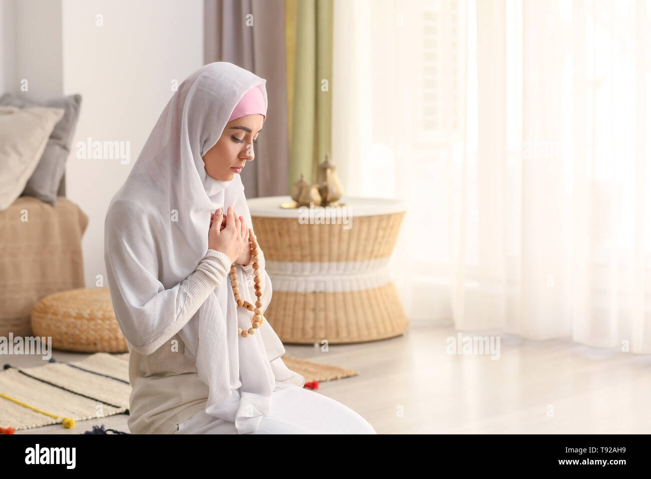 Muslim Woman Praying At Home Young Muslim Woman Praying At Home Stock