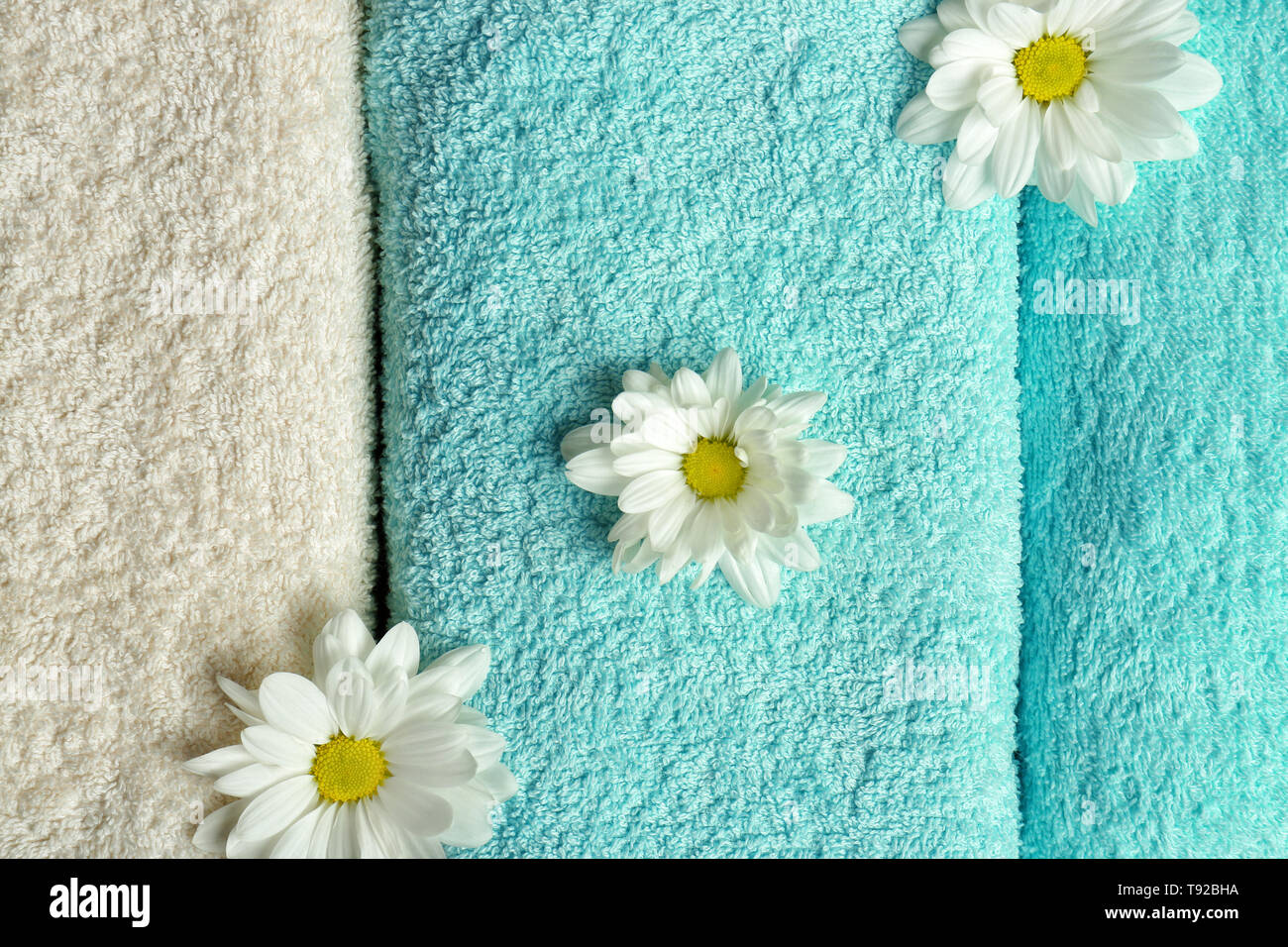 Clean soft towels with flowers, top view Stock Photo - Alamy