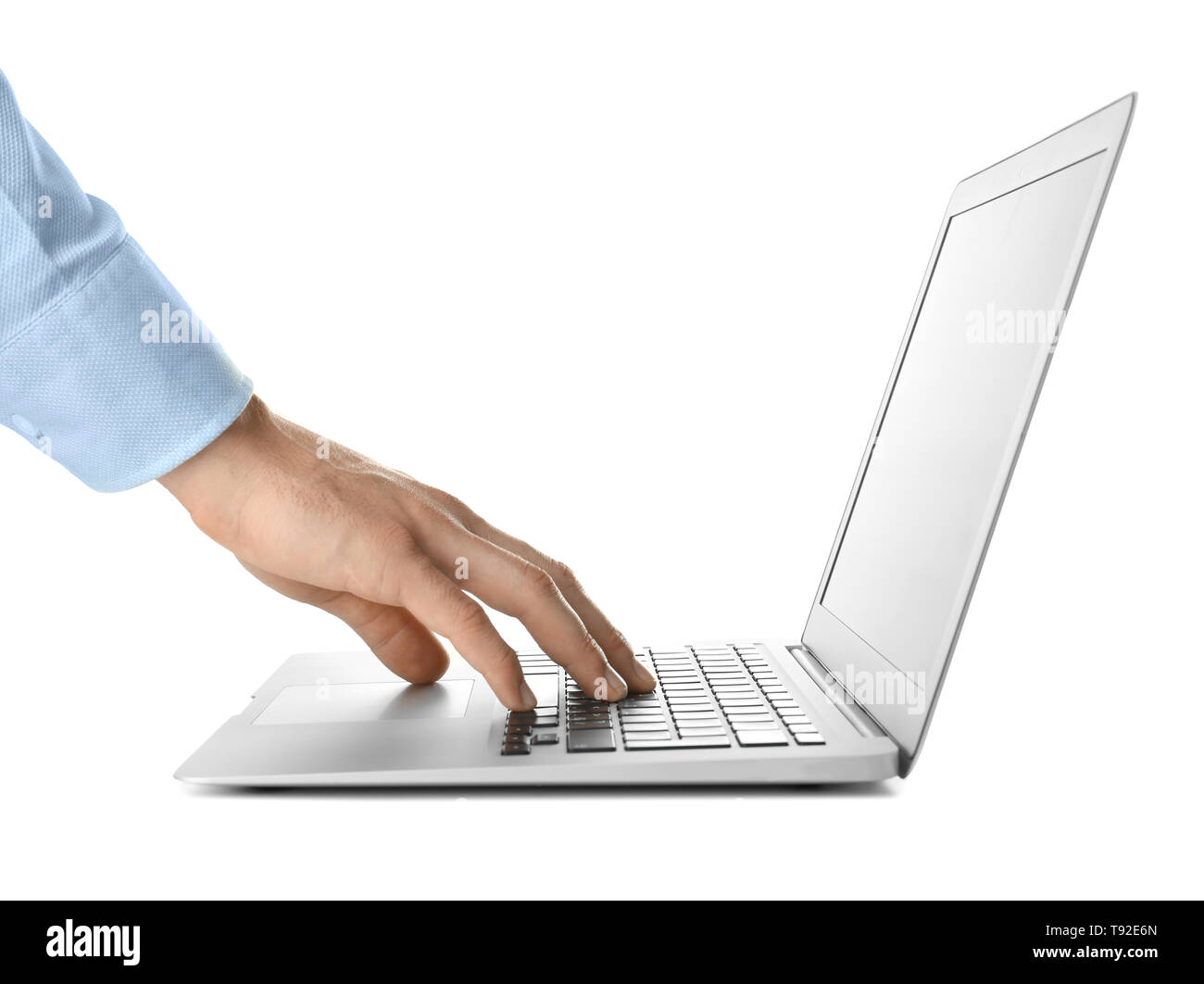 Young businessman using laptop on white background Stock Photo - Alamy