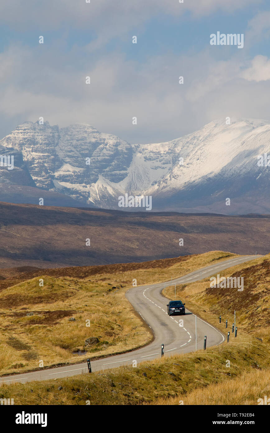 A832 with snow clad An Teallach in the distance Stock Photo - Alamy