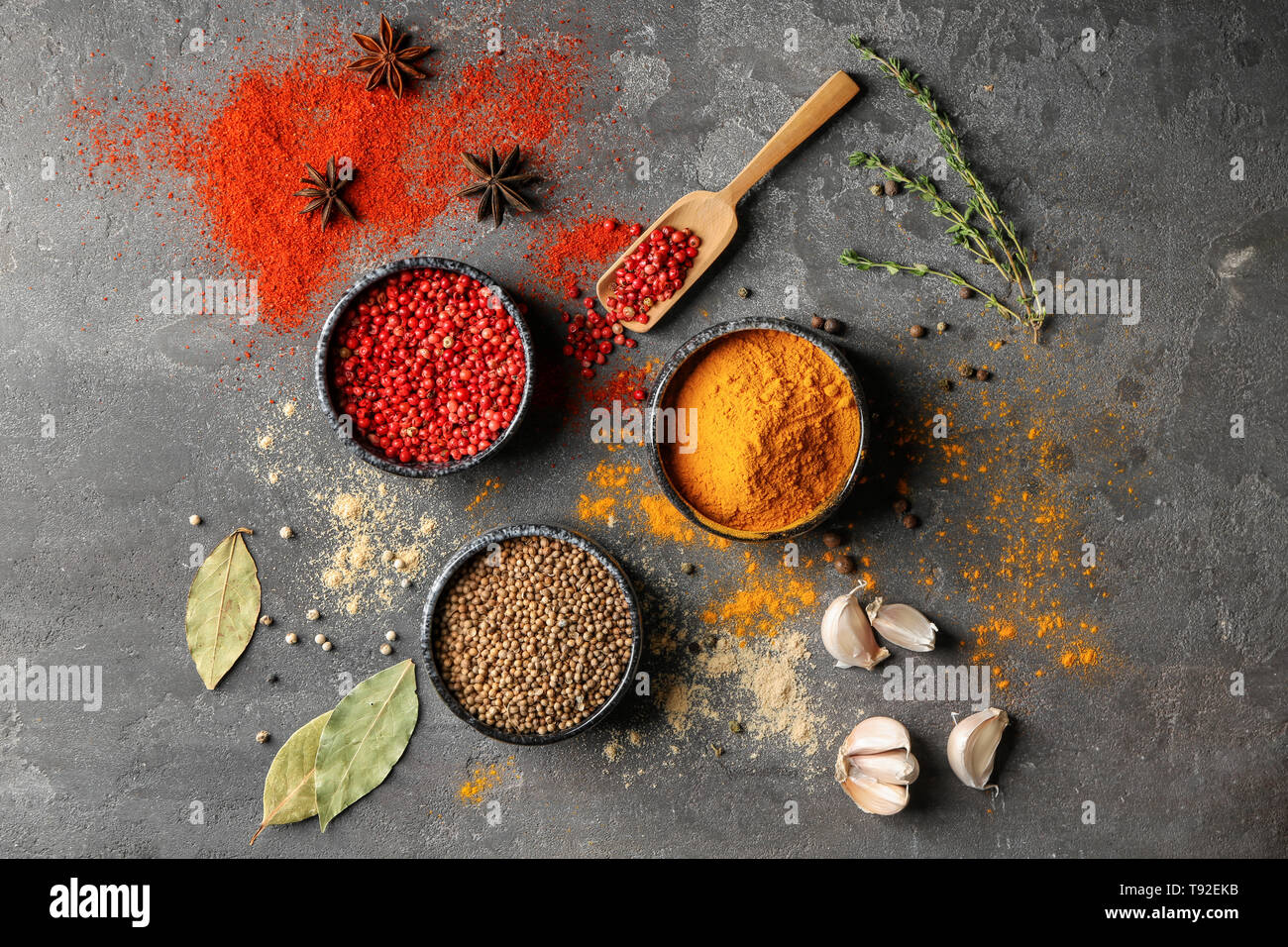 Bowls with different aromatic spices on grey background Stock Photo - Alamy
