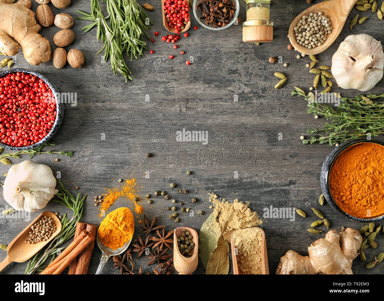 Frame made of different aromatic spices on grey background Stock Photo ...