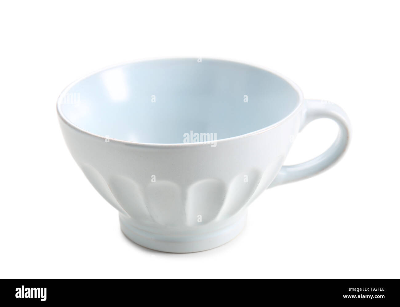 Clean empty cup on white background Stock Photo - Alamy