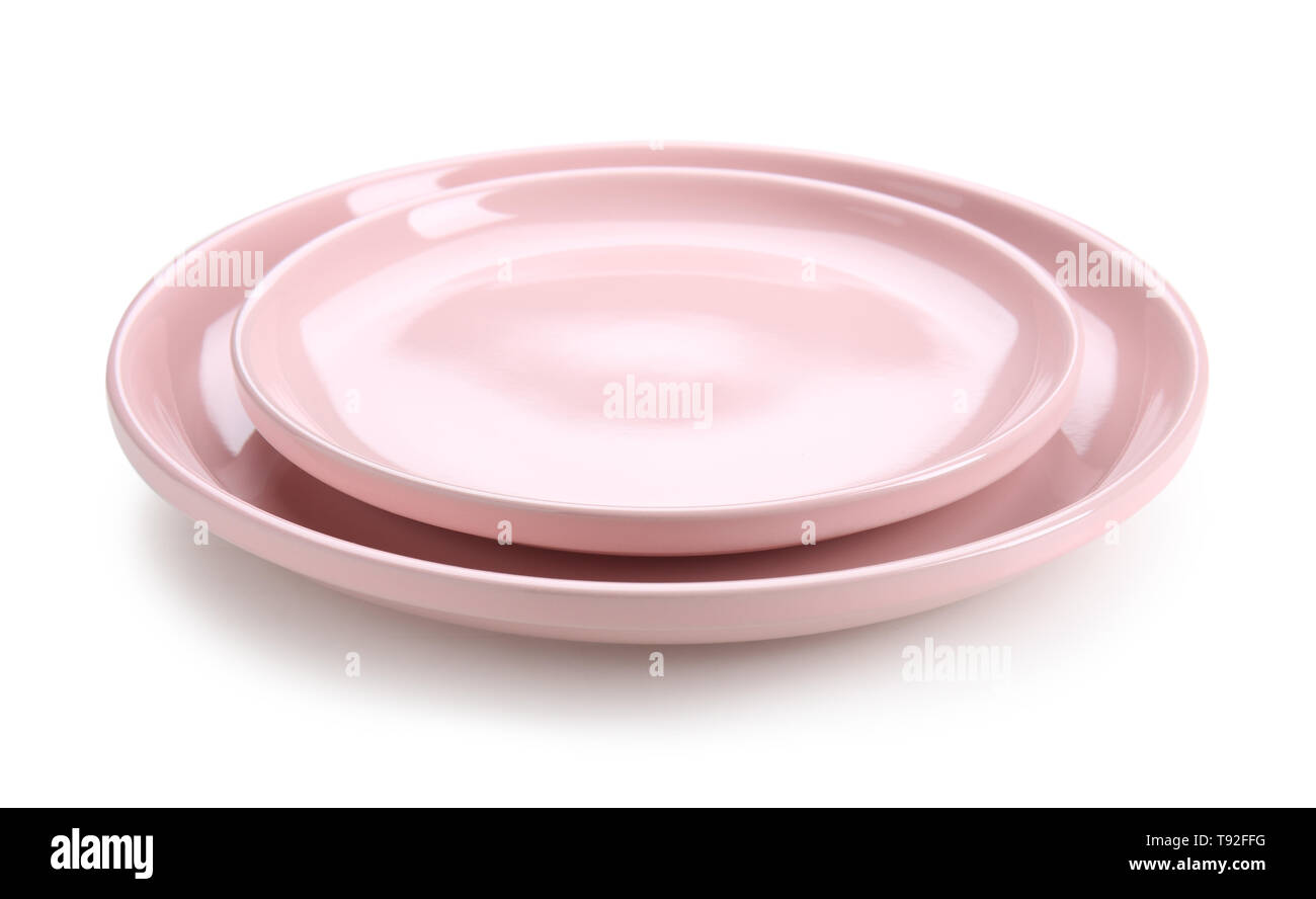 Clean empty plates on white background Stock Photo - Alamy