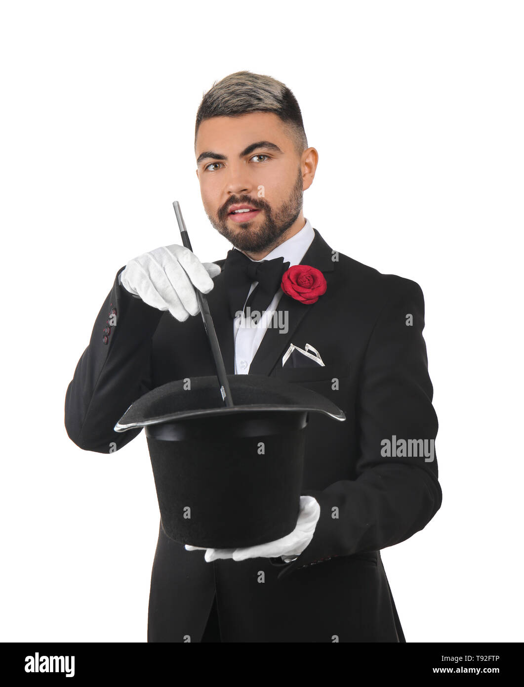 Male magician showing tricks with hat on white background Stock Photo ...