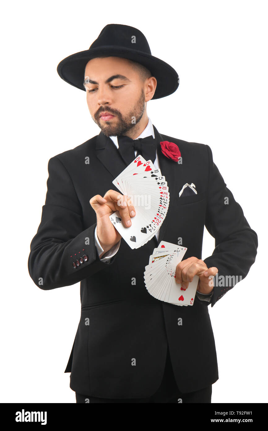 Male magician showing tricks with cards on white background Stock Photo ...