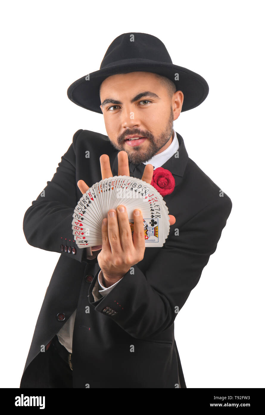 Male magician showing tricks with cards on white background Stock Photo ...