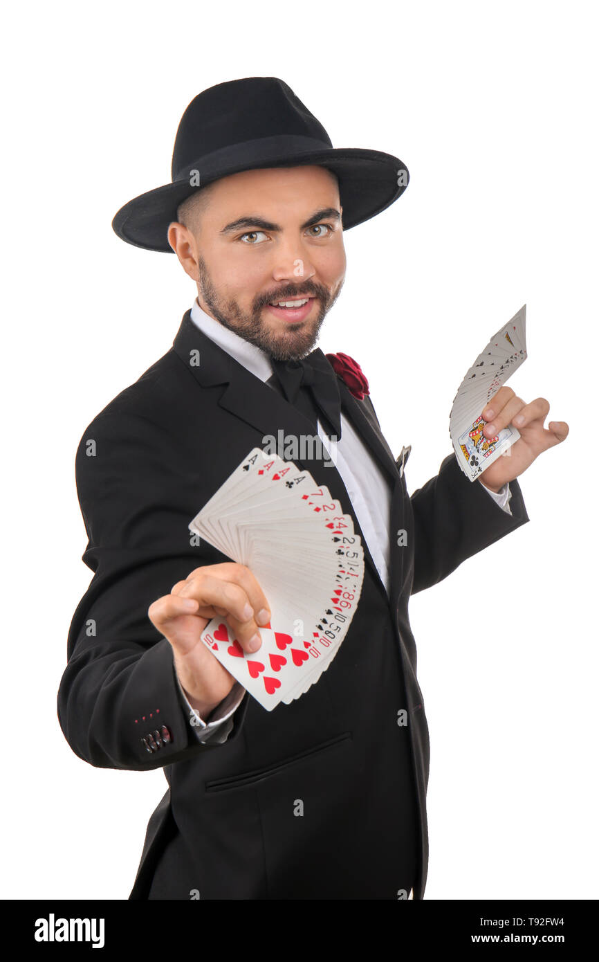 Male magician showing tricks with cards on white background Stock Photo ...