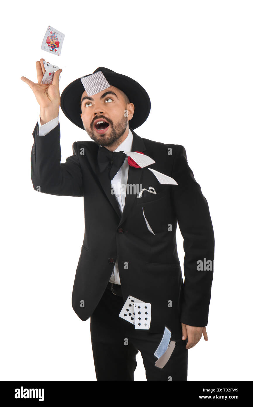 Male magician showing tricks with cards on white background Stock Photo ...