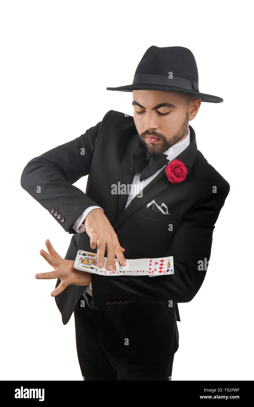 Male magician showing tricks with cards on white background Stock Photo ...