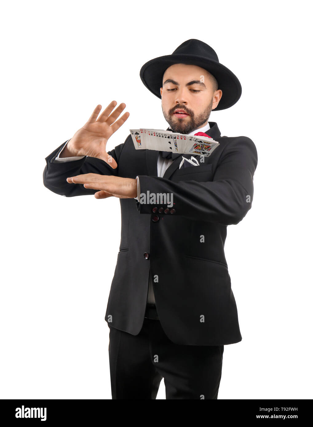 Male magician showing tricks with cards on white background Stock Photo ...