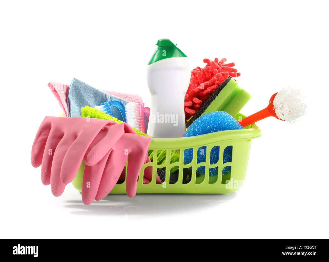 Basket with cleaning supplies on white background Stock Photo - Alamy