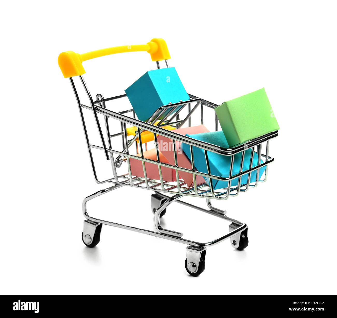 Shopping cart with small boxes on white background Stock Photo - Alamy
