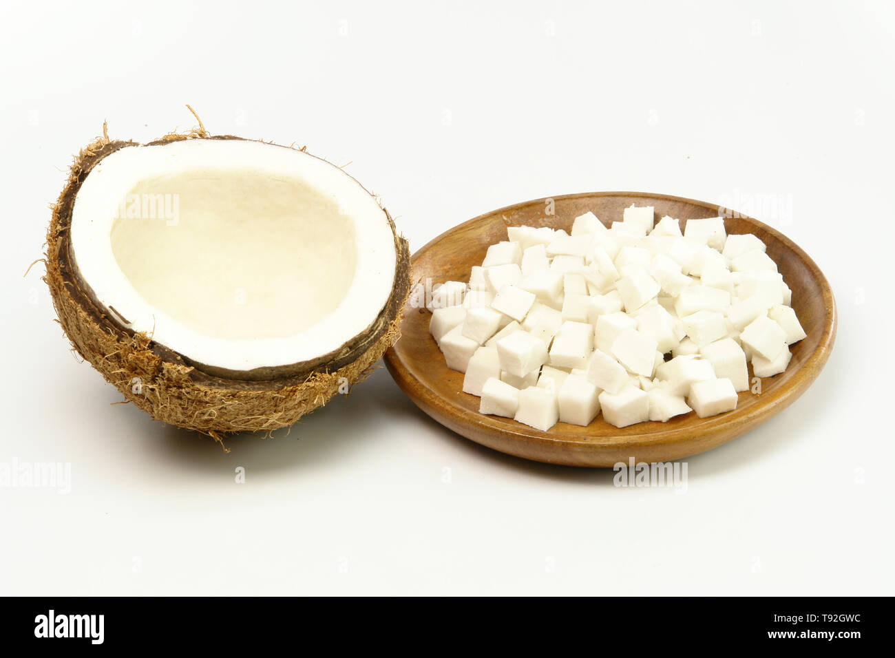 Fresh cracked coconut on white background Stock Photo - Alamy