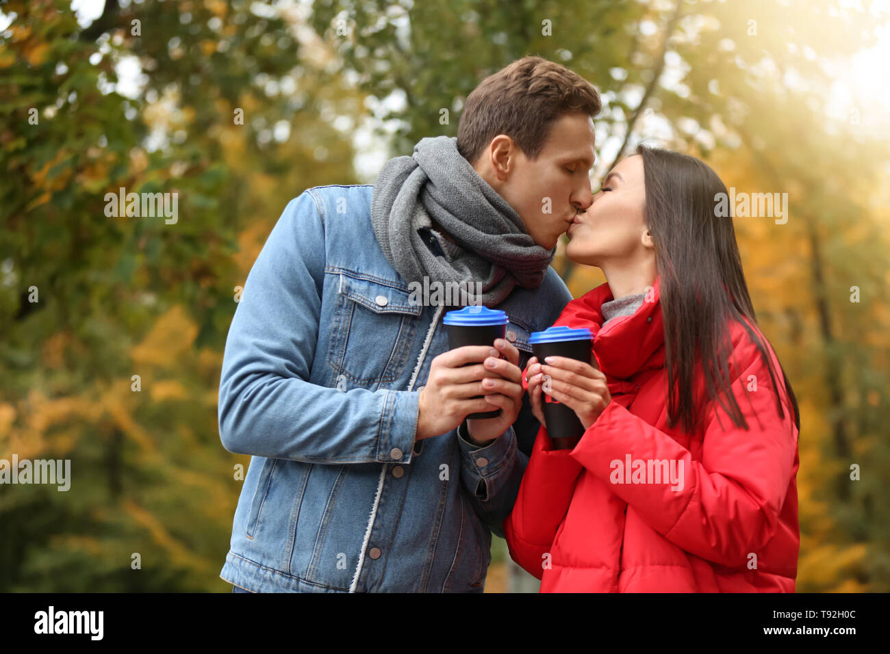 Romantic couple kissing having coffee hi-res stock photography and ...