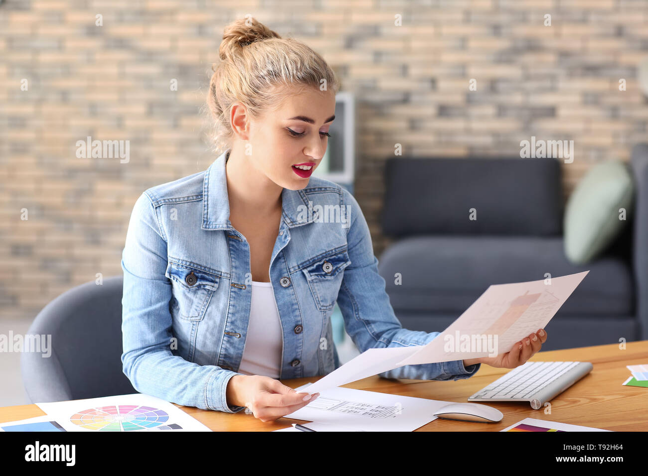 Beautiful young designer working in office Stock Photo - Alamy
