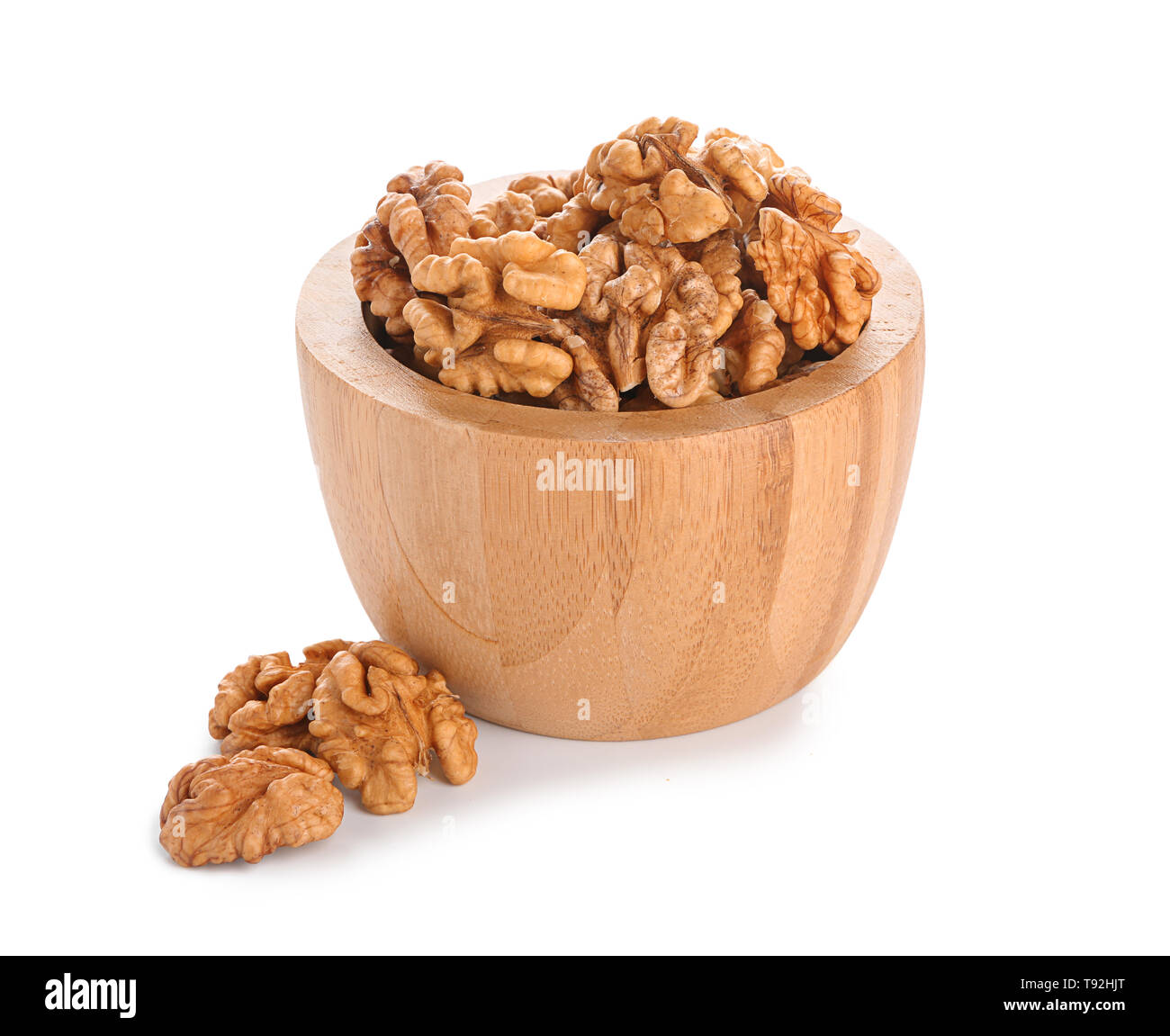 Bowl with shelled walnut on white background Stock Photo - Alamy