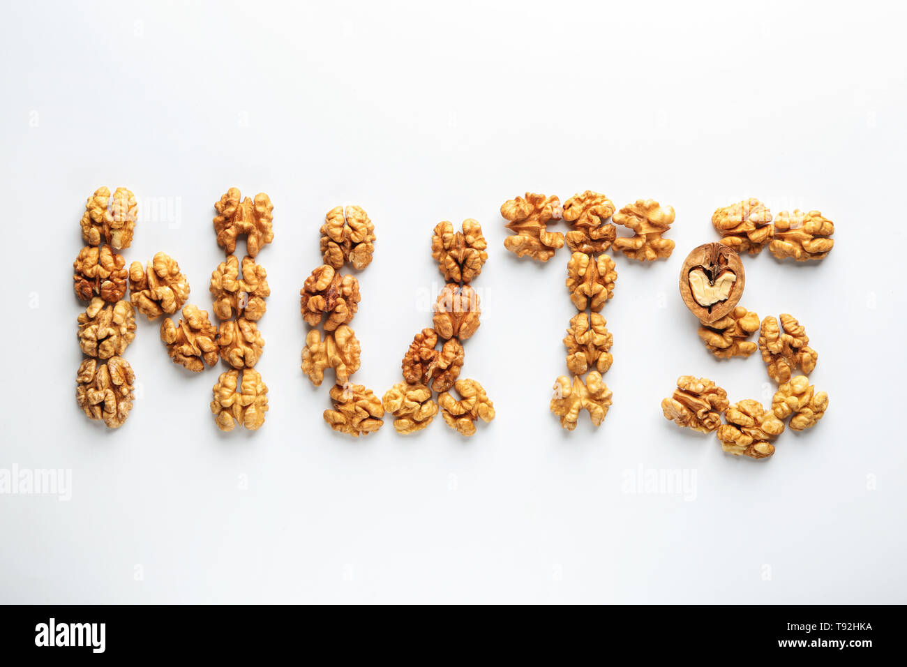 Word NUTS made of walnut on white background Stock Photo - Alamy