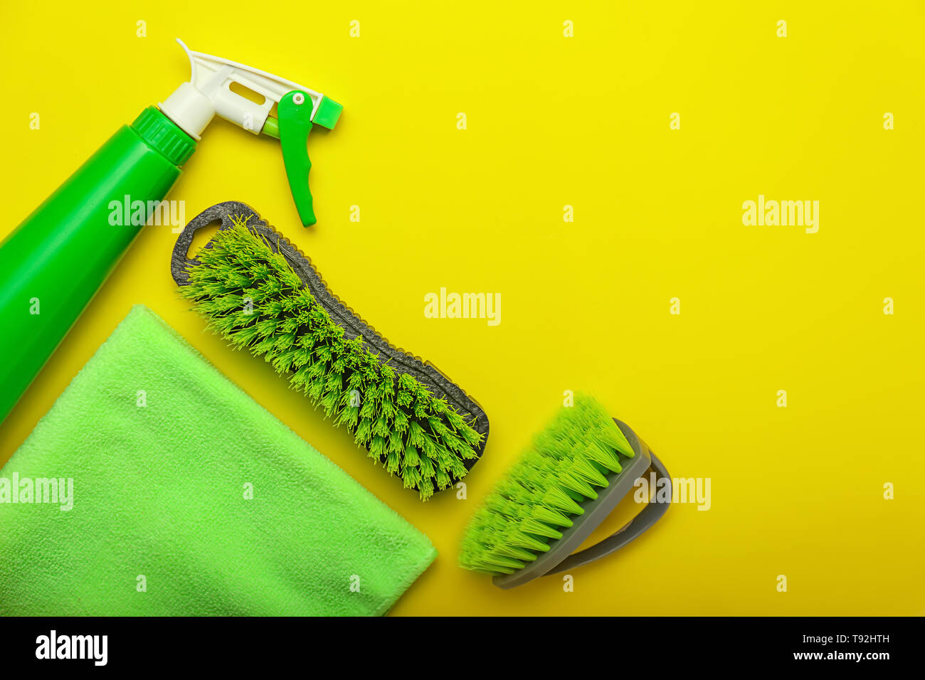Cleaning supplies on color background Stock Photo - Alamy