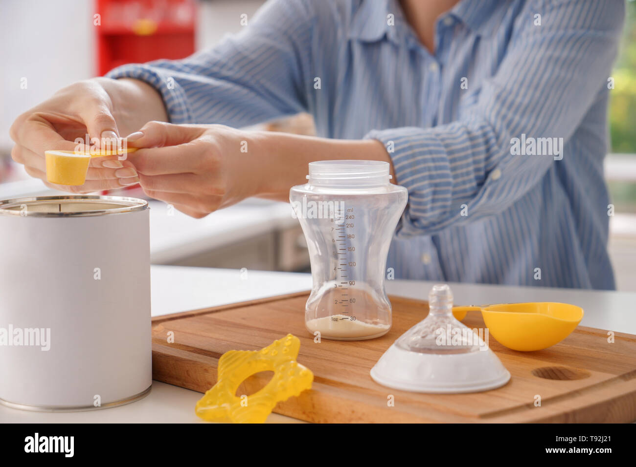 Woman preparing baby formula hi-res stock photography and images - Alamy