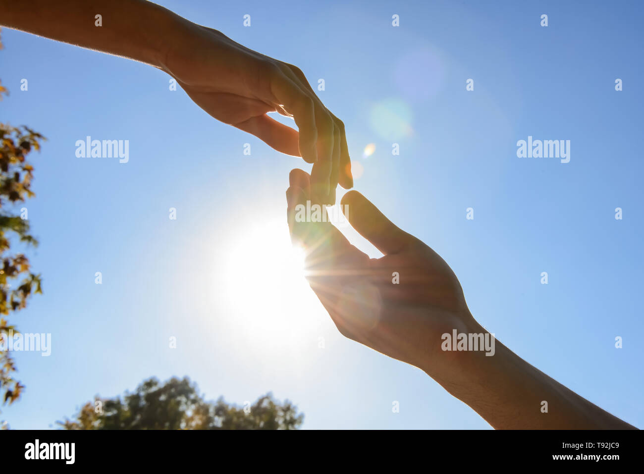 Woman reaching out to other woman hi-res stock photography and images ...