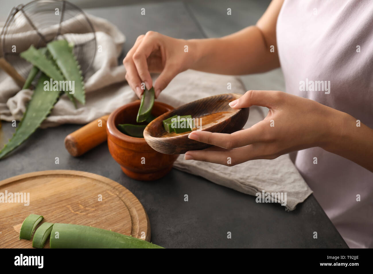 Woman making organic cosmetics with aloe. Health care concept Stock ...