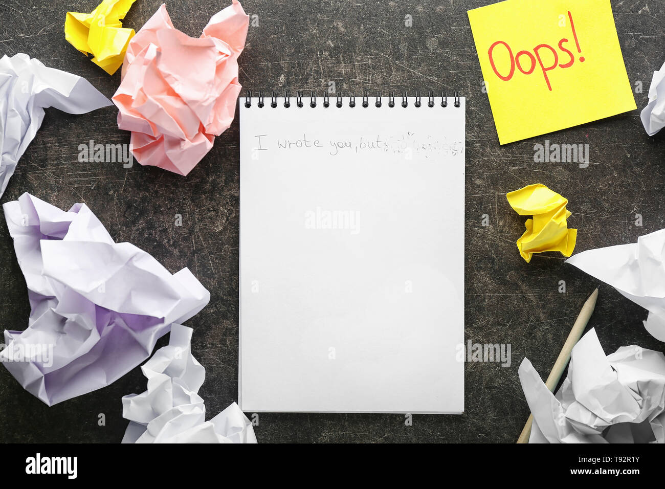 Blank notebook and crumpled paper on table. Mistake concept Stock Photo ...