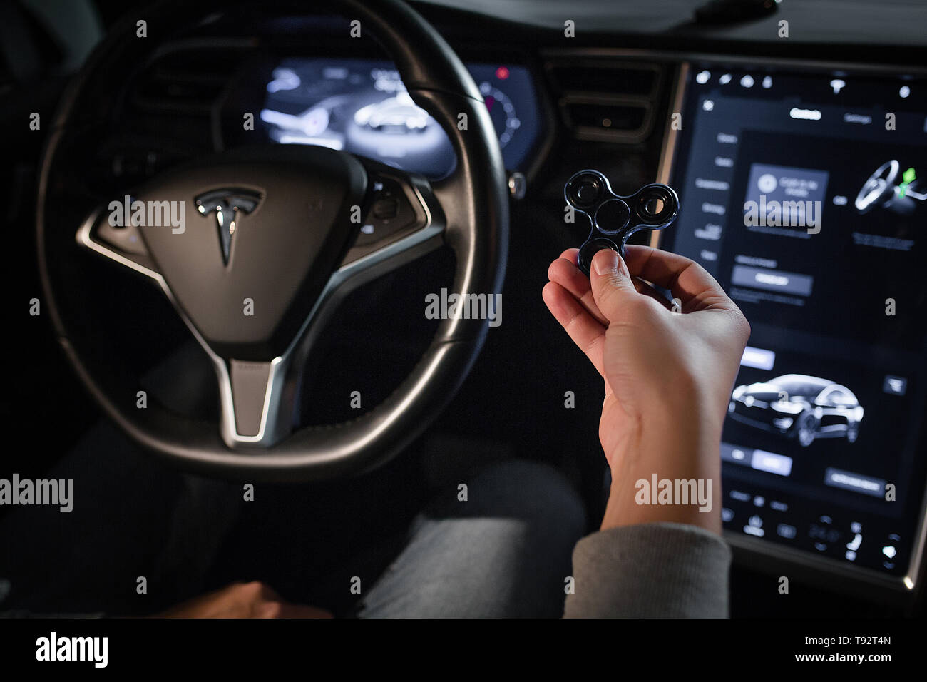 Inside view of Tesla Electric Vehicle. Sreering Wheel and Displays ...