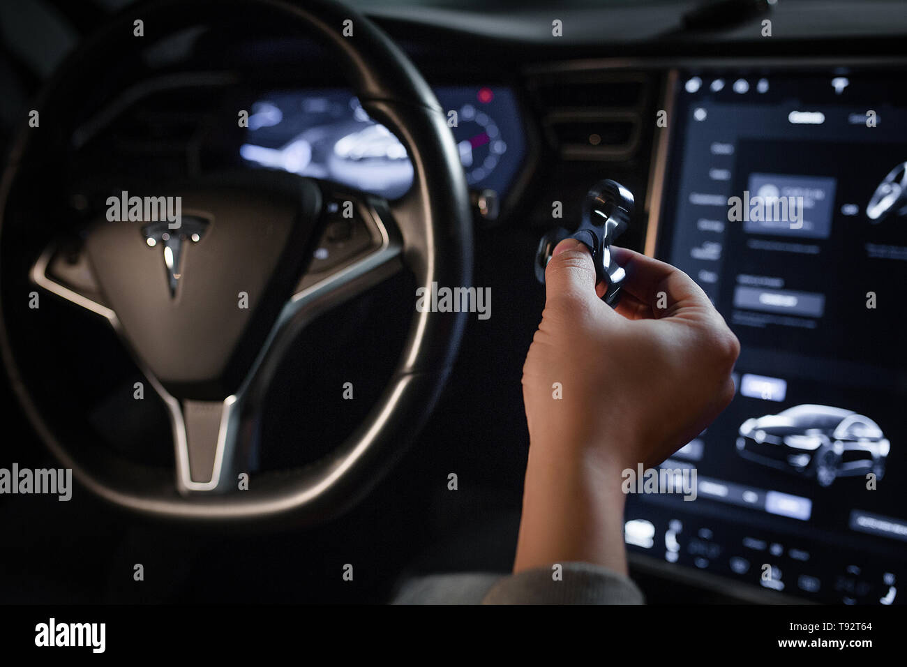 Inside view of Tesla Electric Vehicle. Sreering Wheel and Displays ...