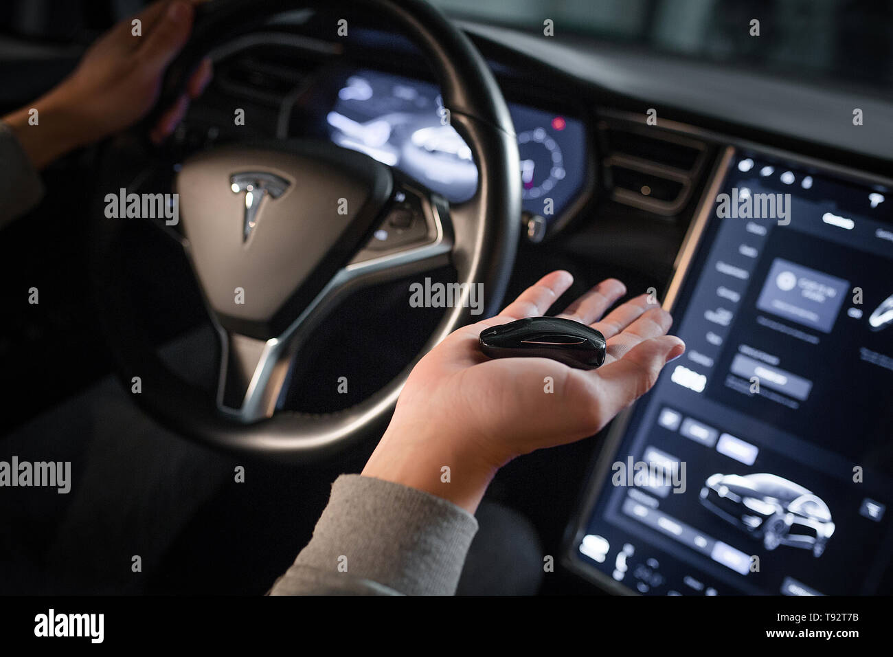 Inside view of Tesla Electric Vehicle. Sreering Wheel and Displays ...