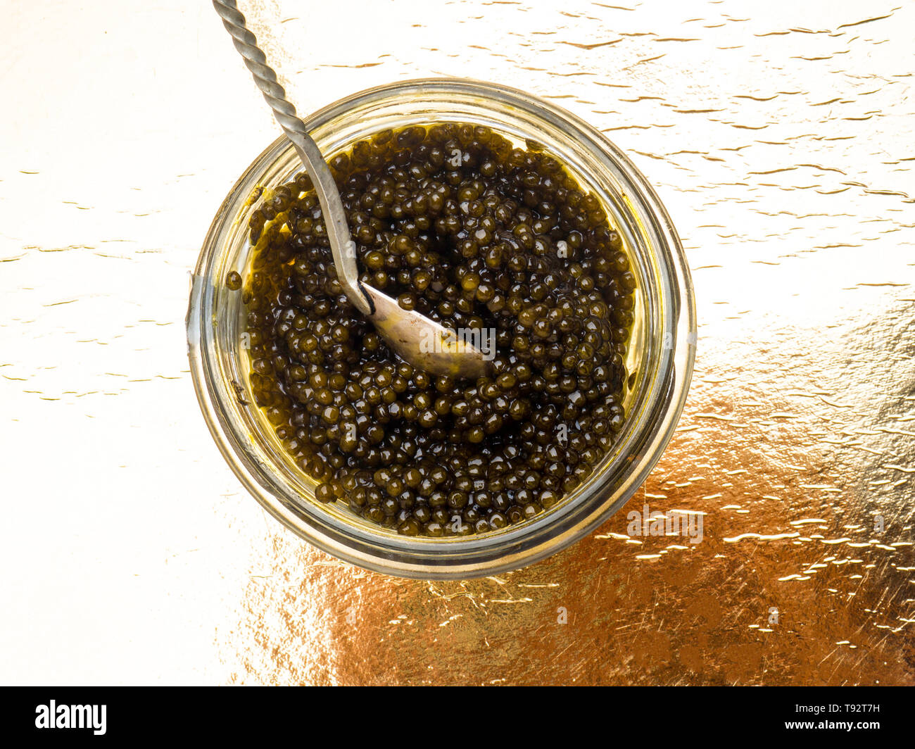 Black caviar, luxurious delicacy on golden background, protein rich ...