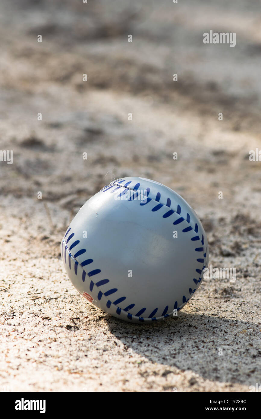 Phillies Soft Baseball in the Sand Stock Photo - Alamy