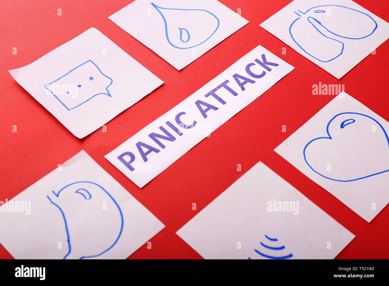 Paper cards with different drawings and text PANIC ATTACK on color ...