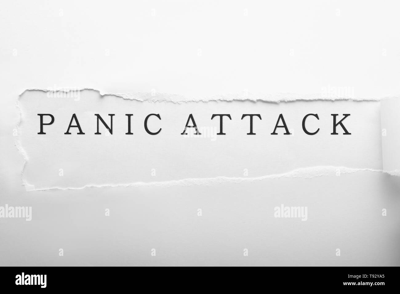 Text PANIC ATTACK appearing behind torn paper Stock Photo - Alamy