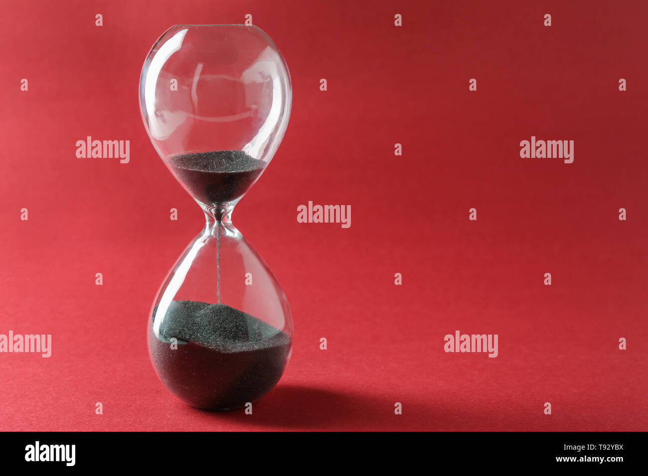 Hourglass on color background. Time management concept Stock Photo - Alamy