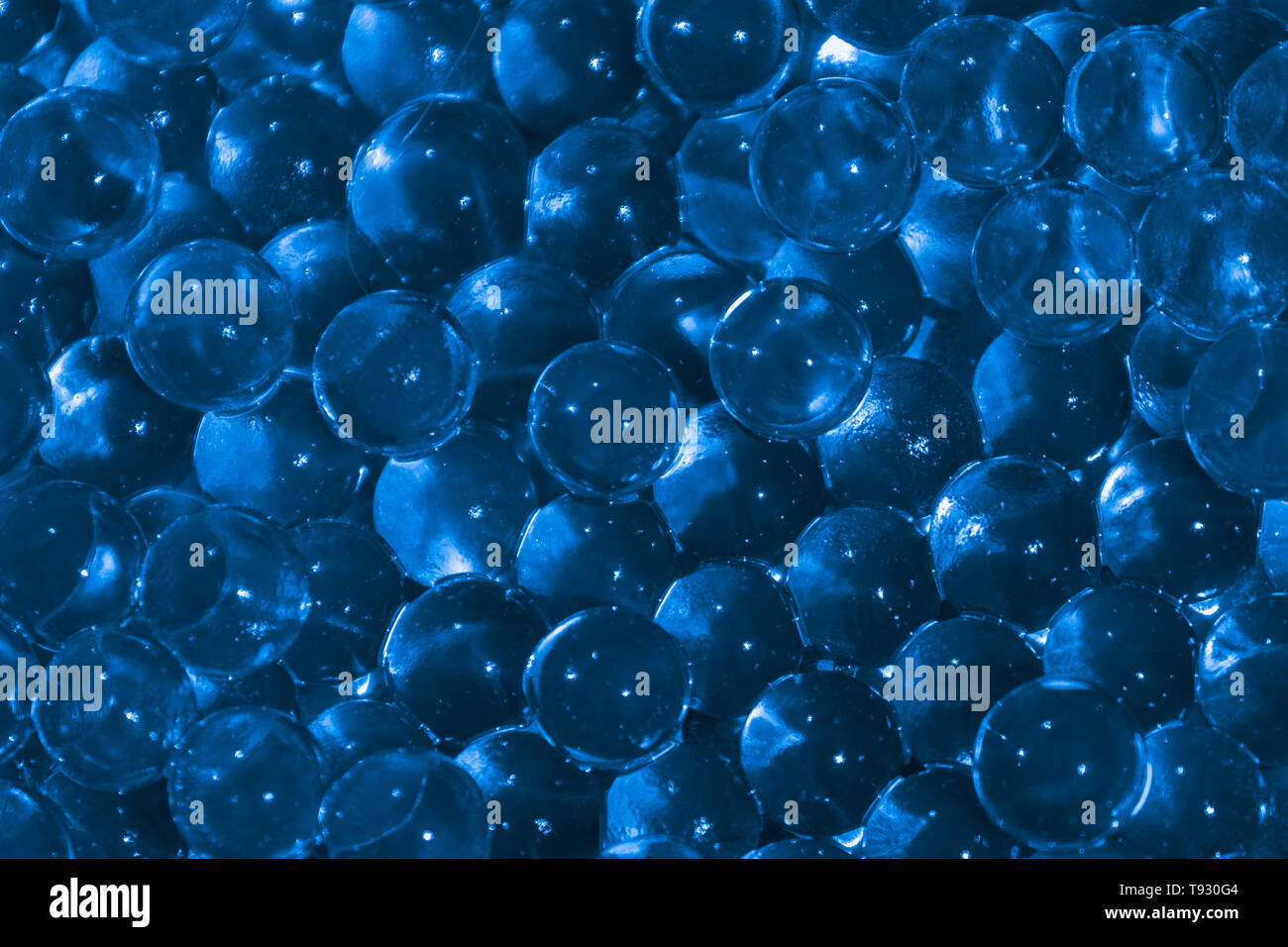 Transparent blue hydrogel balls. Blue water gel balls with bokeh ...