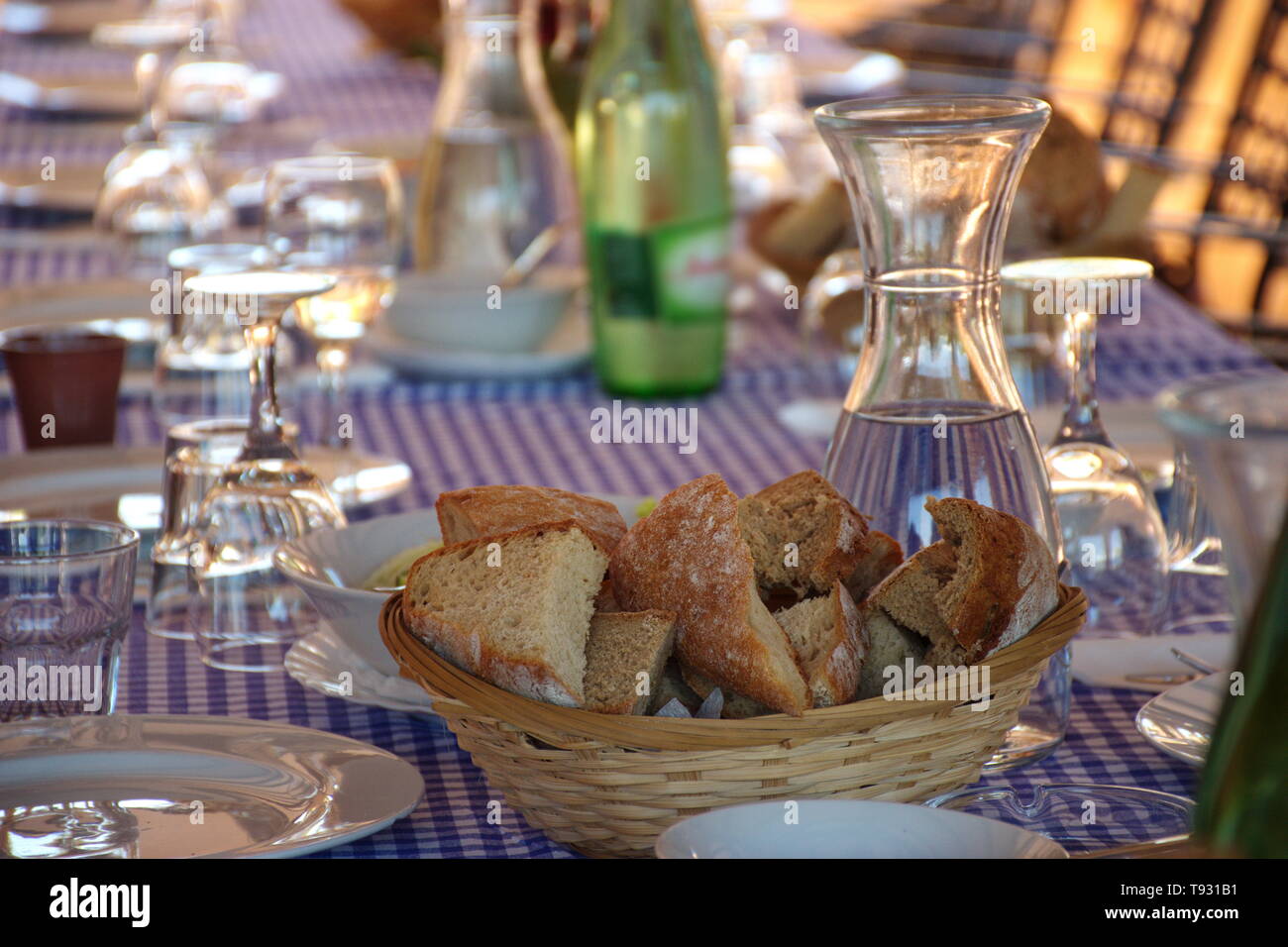 Rustic table prepared for dinner Stock Photo - Alamy