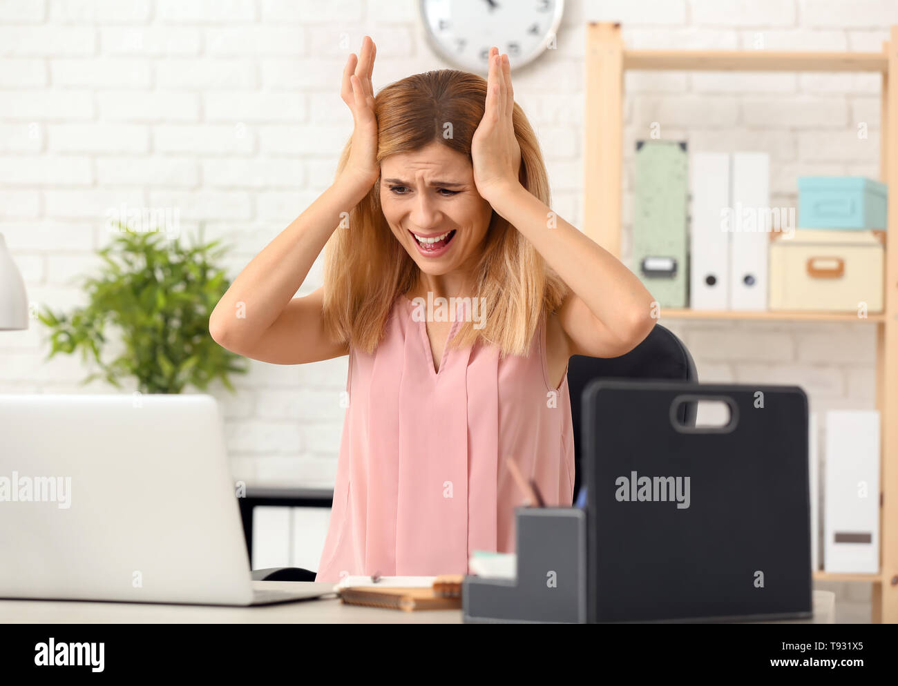 Woman having panic attack at workplace Stock Photo - Alamy